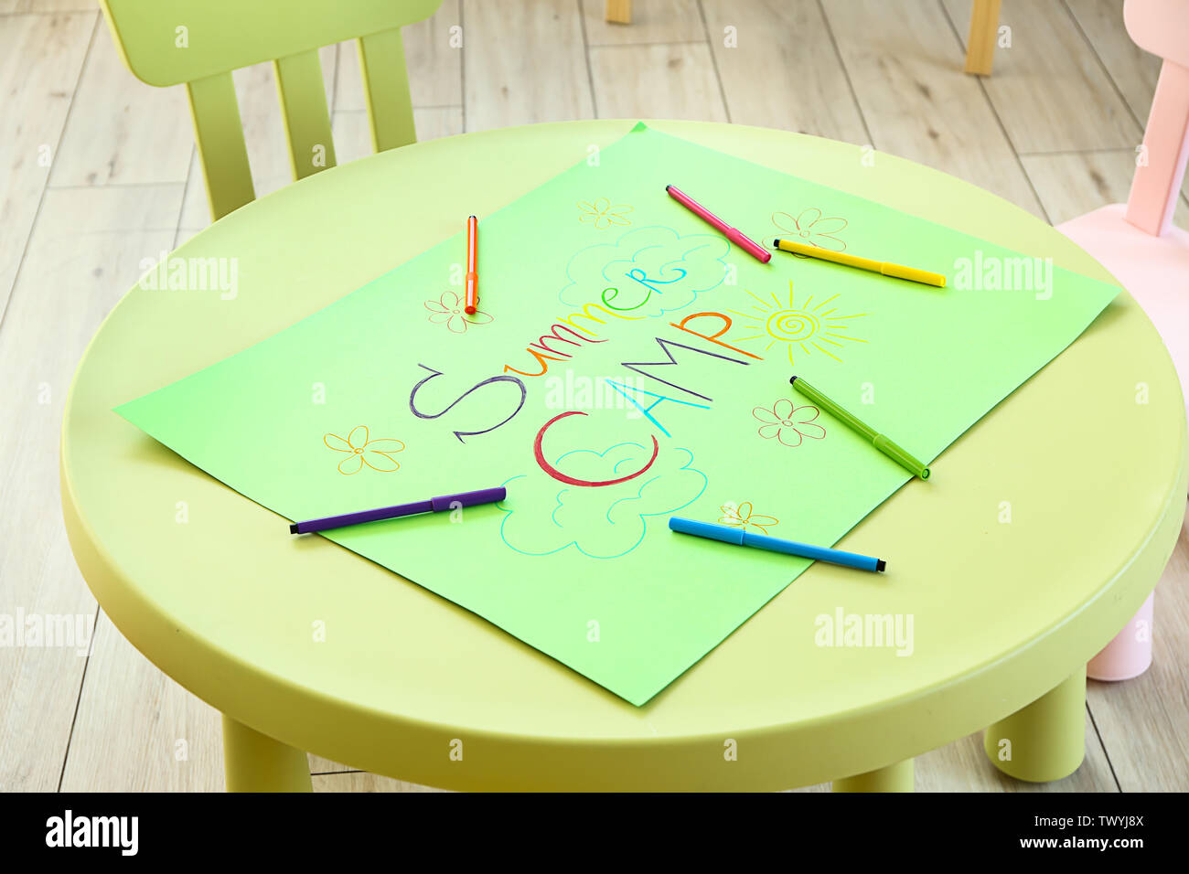 Sheet of paper with text SUMMER CAMP on table Stock Photo - Alamy