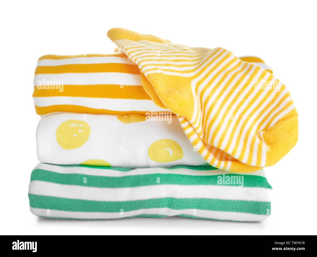 Stack of baby clothes on white background Stock Photo - Alamy