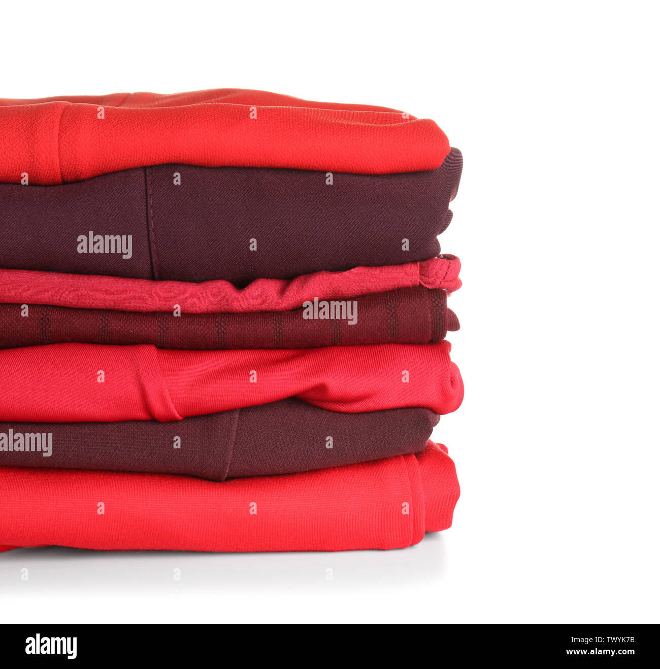 Stack of modern clothes on white background Stock Photo - Alamy