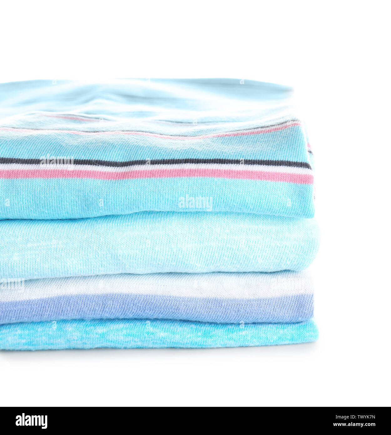 Stack of modern clothes on white background Stock Photo - Alamy