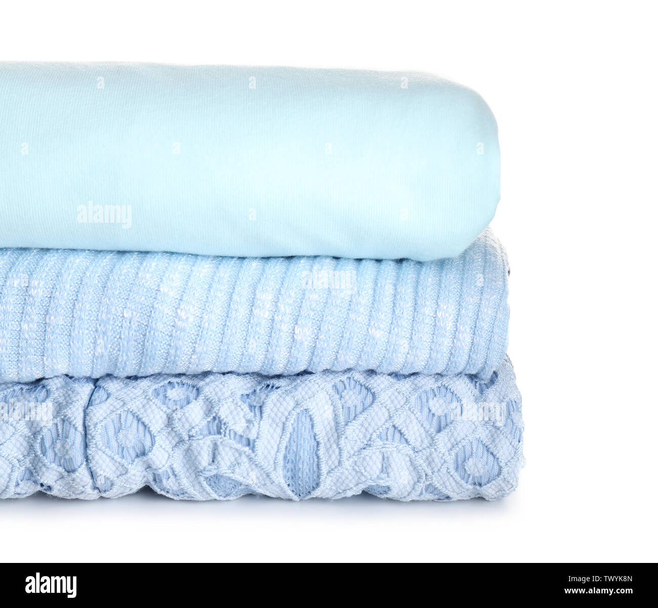 Stack of modern clothes on white background Stock Photo - Alamy