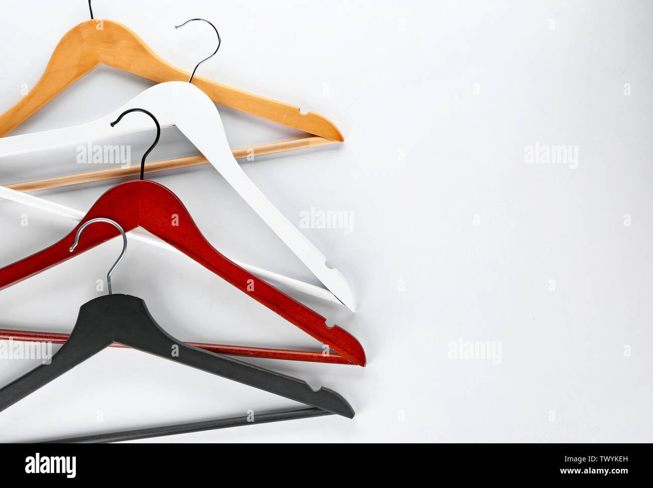 Clothes hangers on white background Stock Photo - Alamy