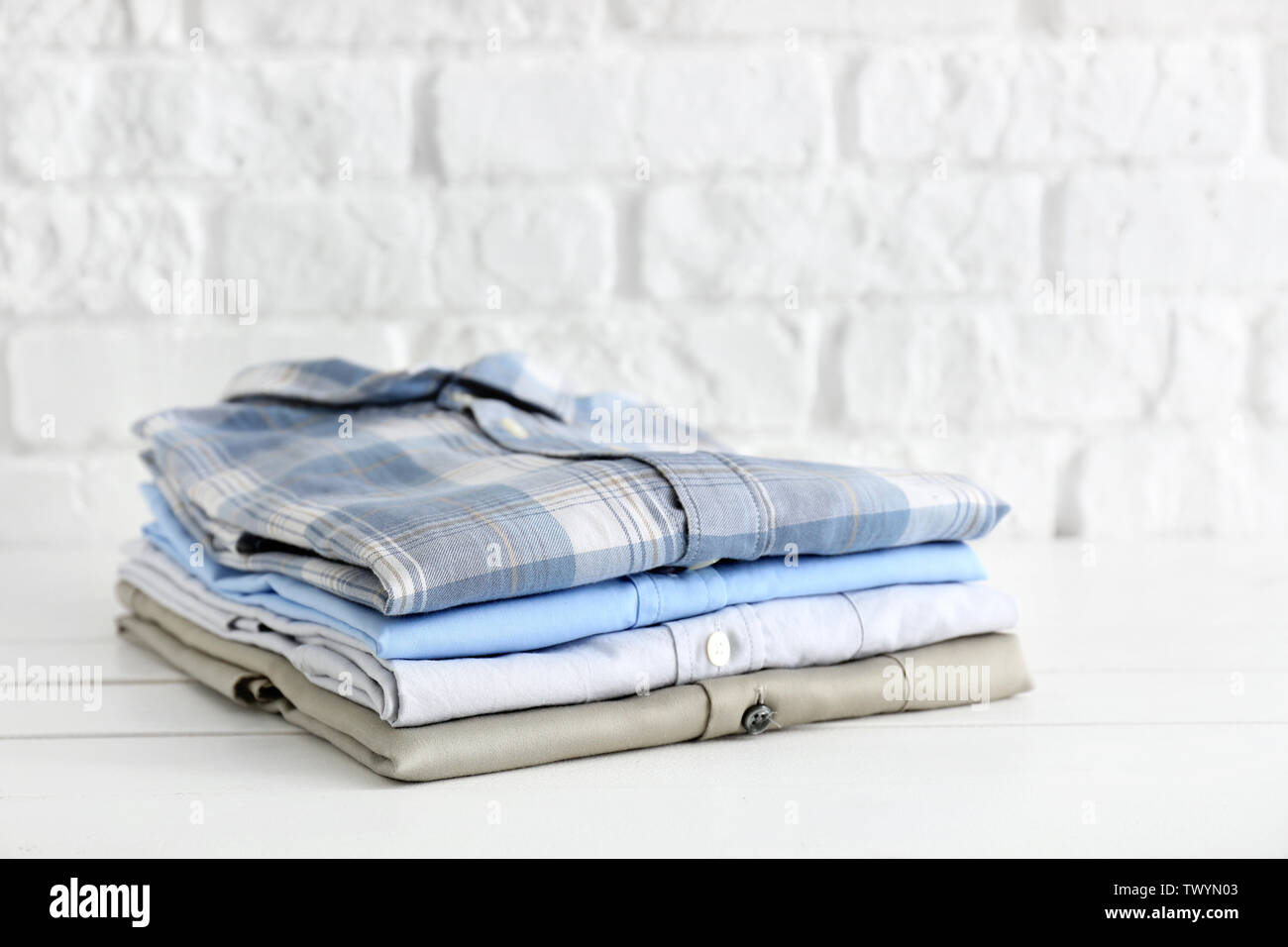 Stack of shirts hi-res stock photography and images - Alamy