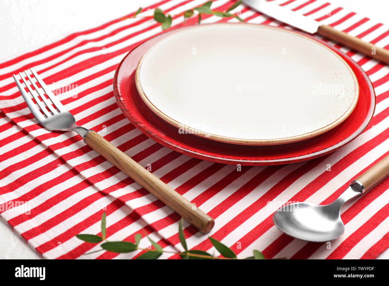 Beautiful table setting on white background Stock Photo - Alamy