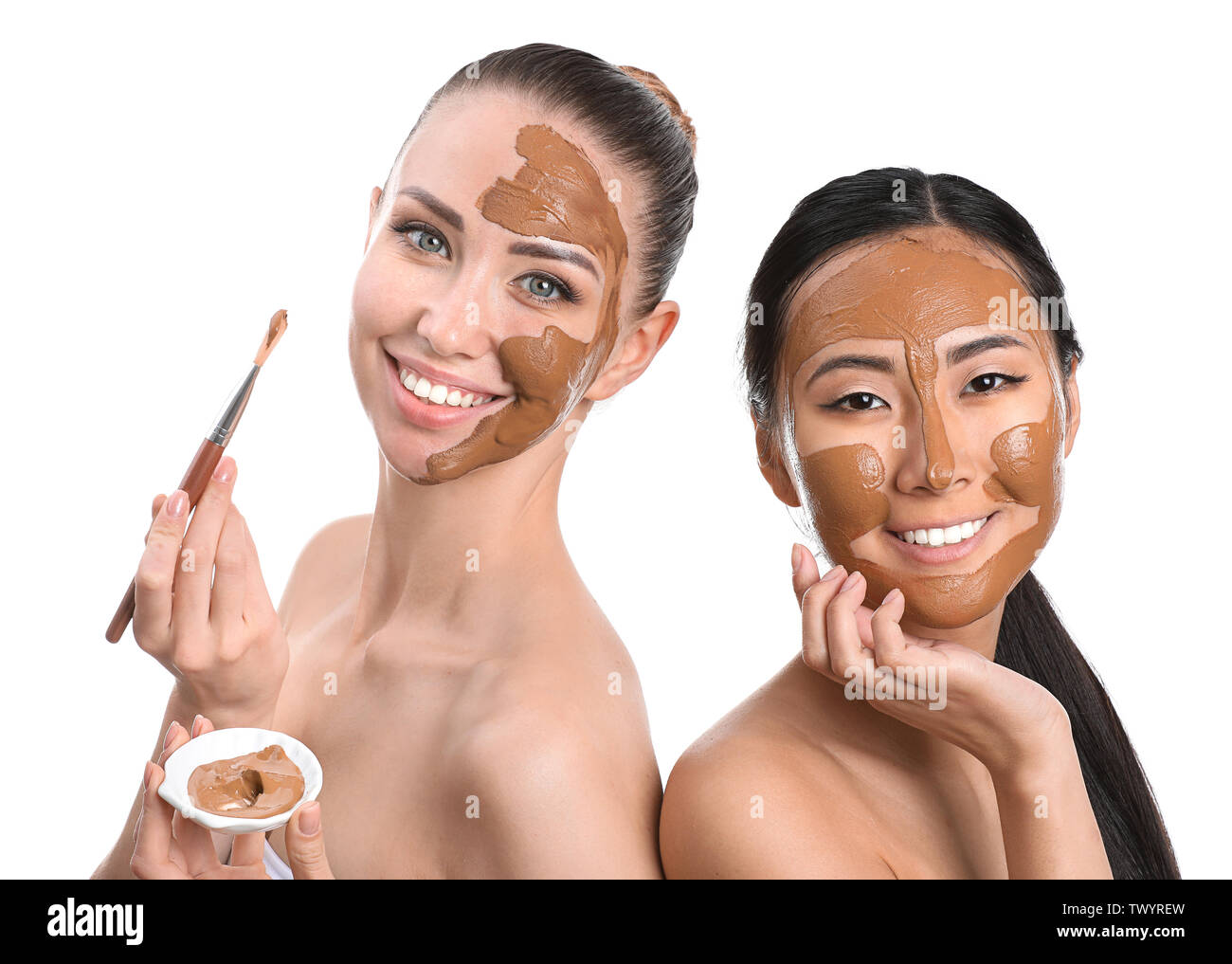 Beautiful women with facial masks on white background Stock Photo - Alamy