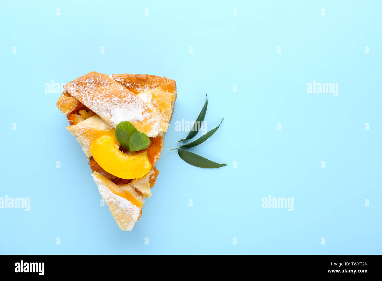 Piece of tasty peach pie on color background Stock Photo - Alamy