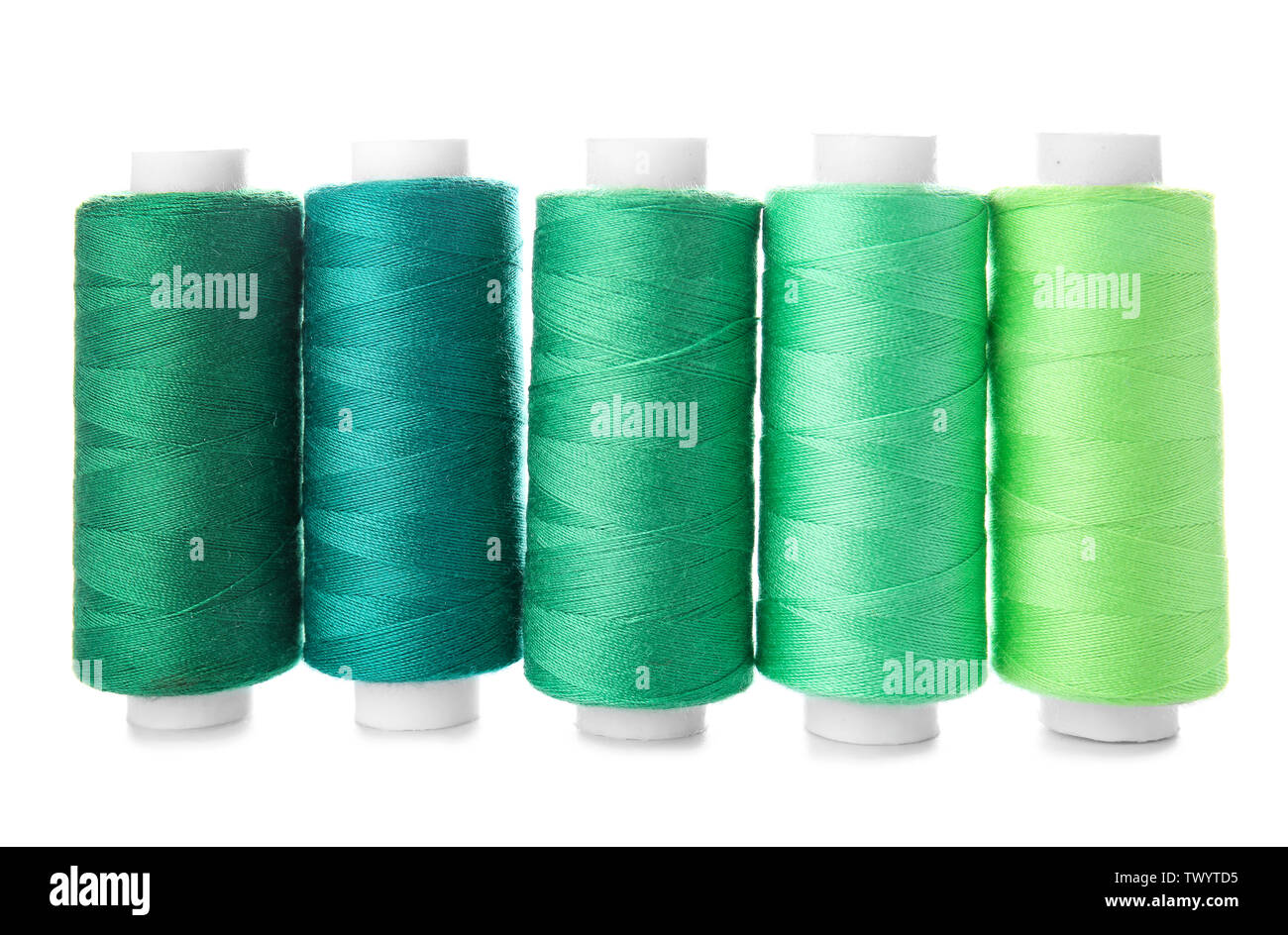 Colorful sewing threads on white background Stock Photo - Alamy