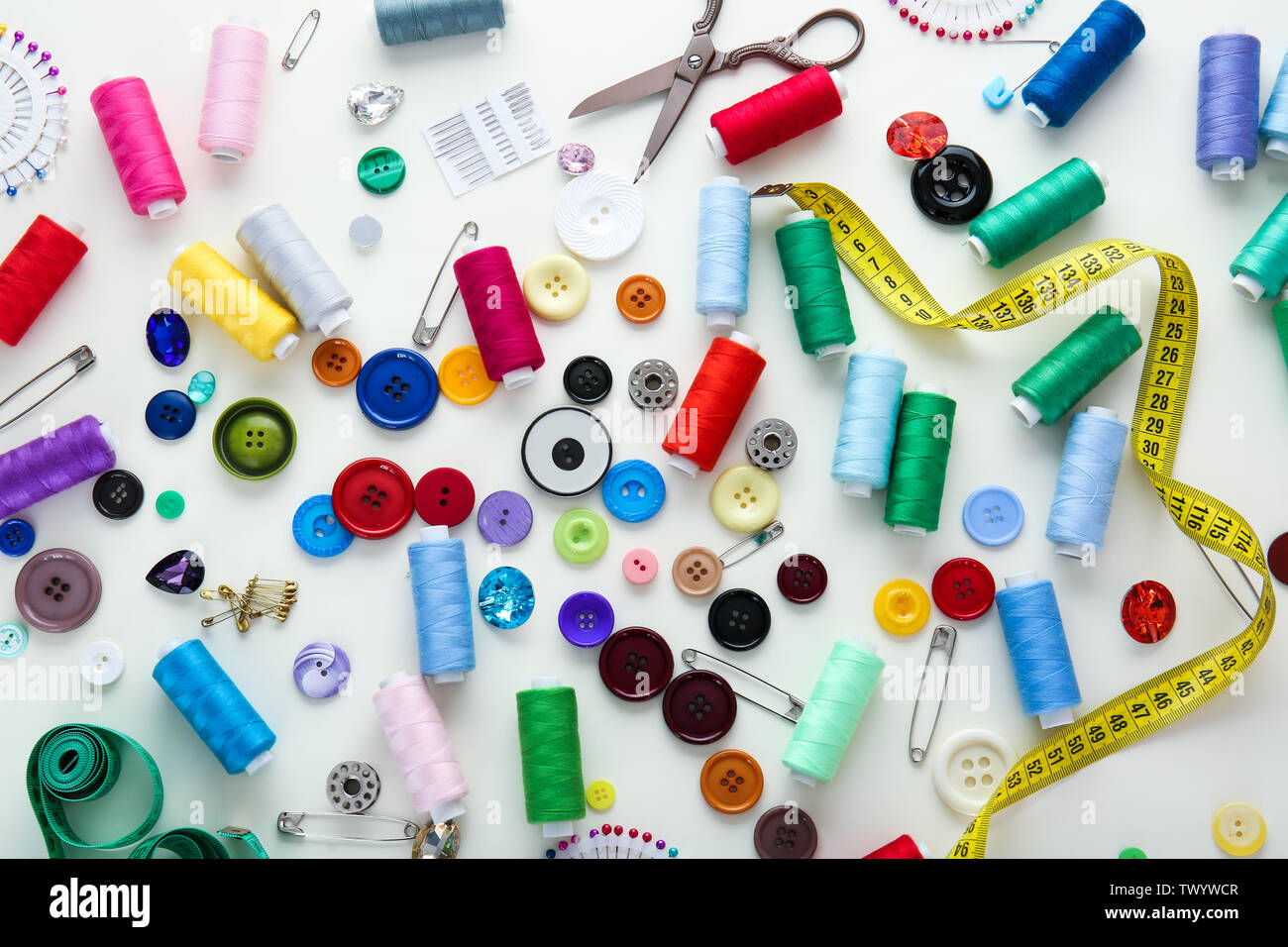 Set of sewing threads and accessories on white background Stock Photo ...