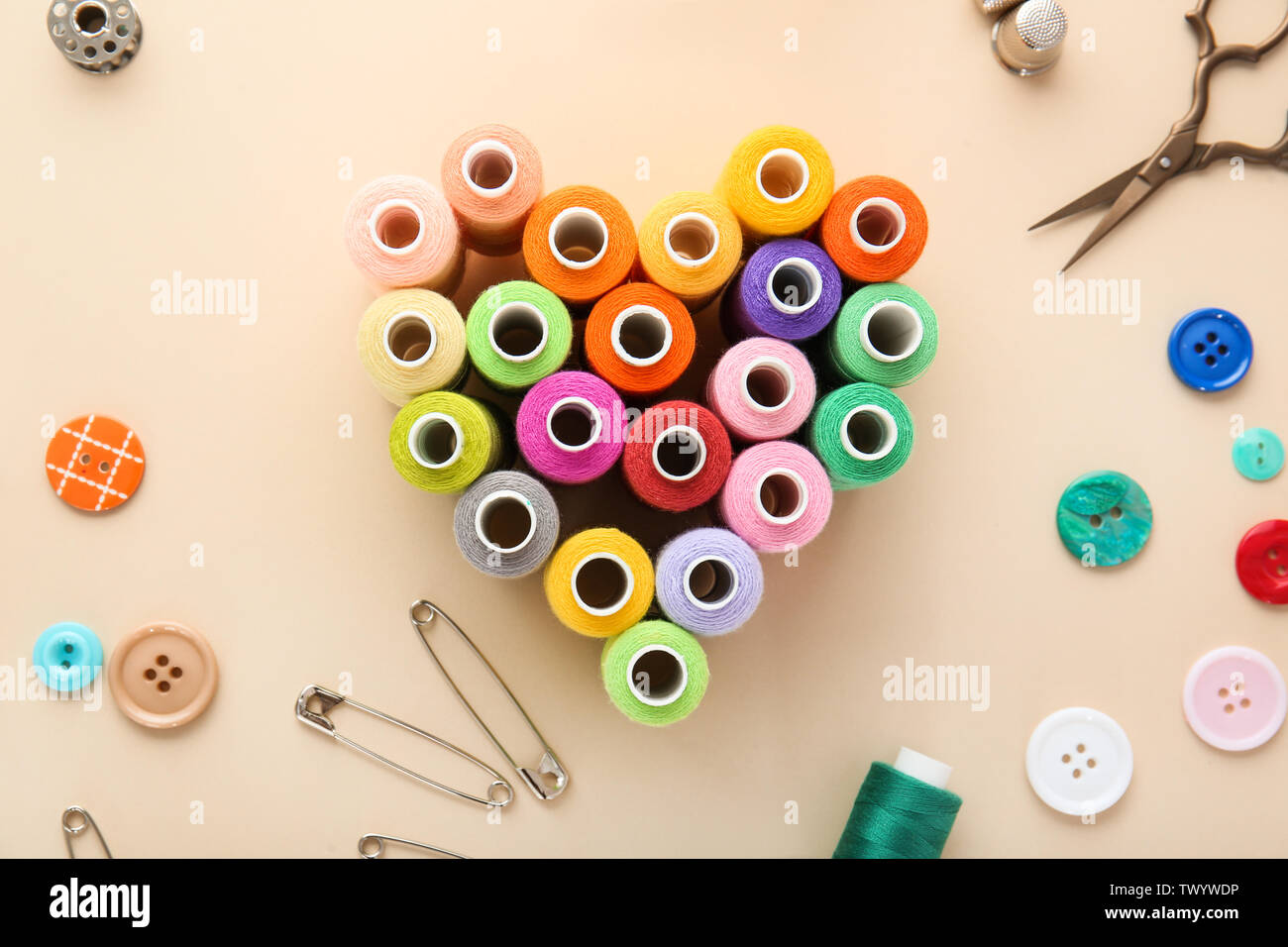 Heart shape made of colorful threads on light background Stock Photo ...