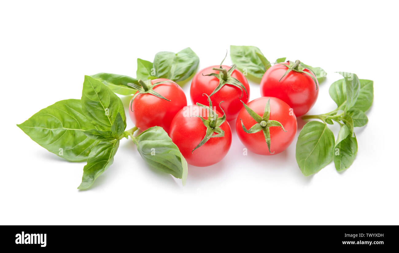Fresh basil and tomato on white background Stock Photo - Alamy