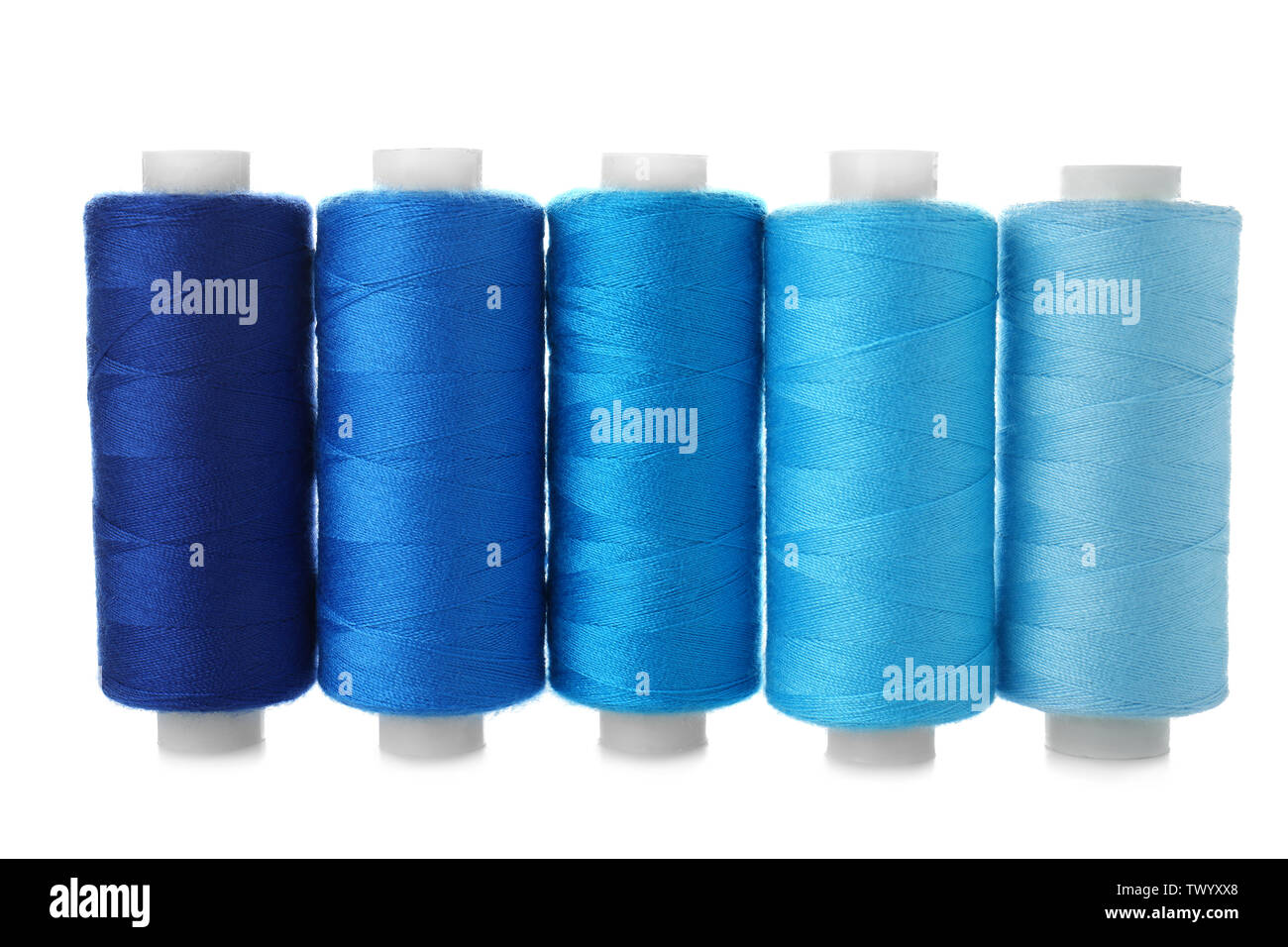 Colorful sewing threads on white background Stock Photo - Alamy