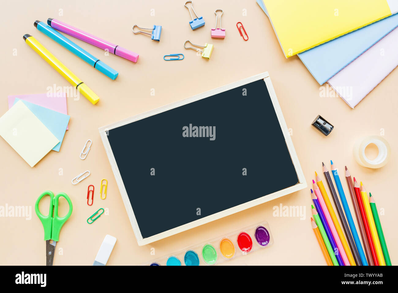 Orange back to school flat lay with bright stationery. School supplies ...