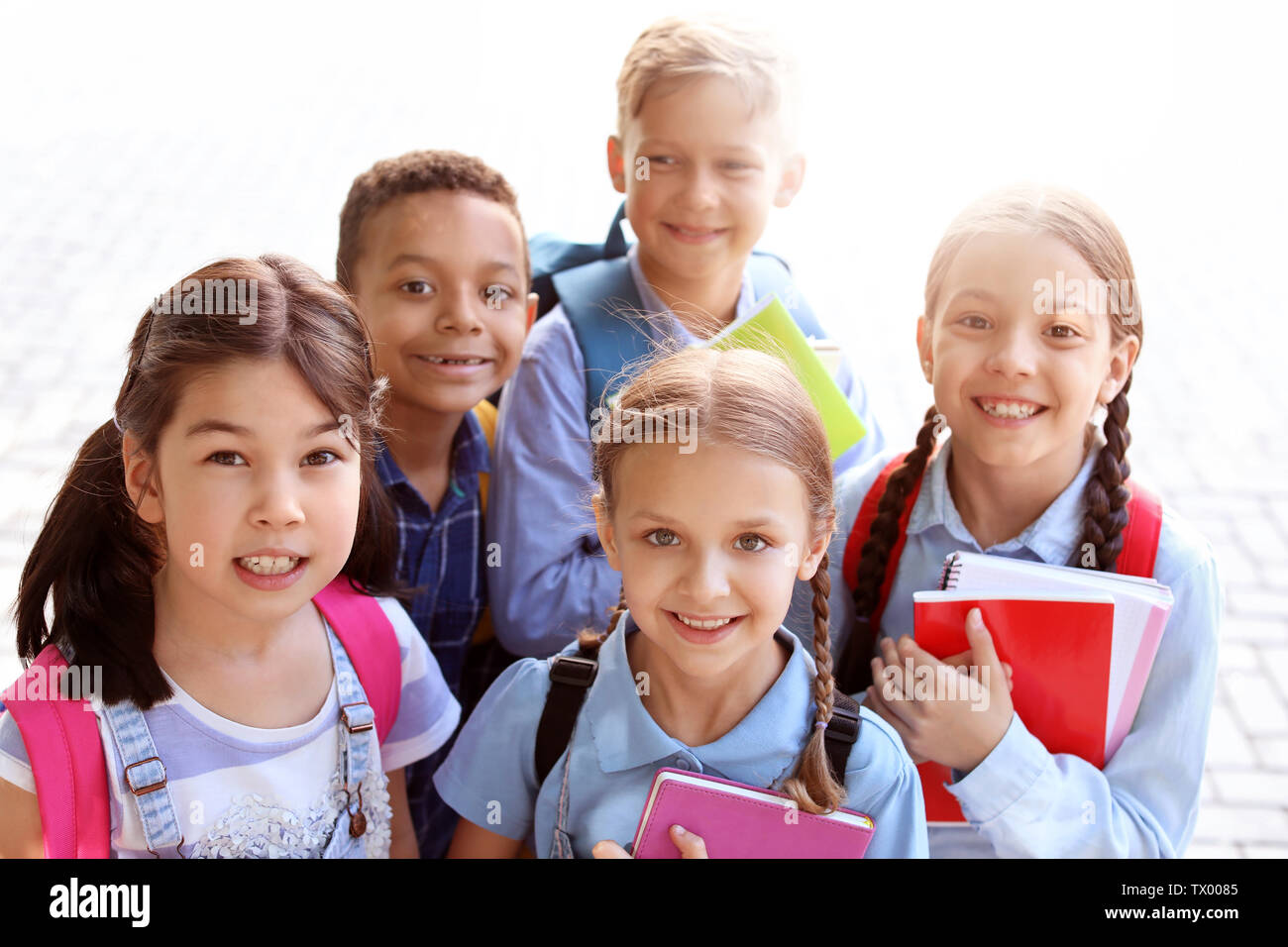 Group of cute little pupils outdoors Stock Photo - Alamy