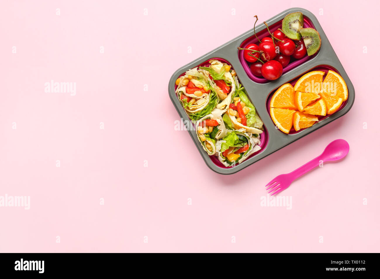 School lunch box with tasty food on color background Stock Photo - Alamy