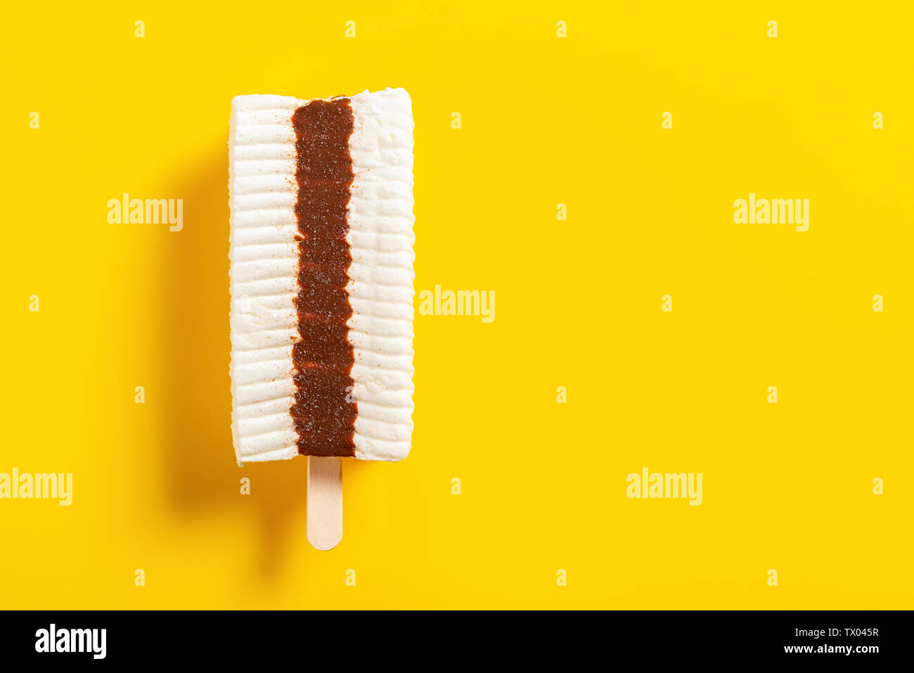 top view fresh chocolate and milkshake flavor popsicle on a yellow ...