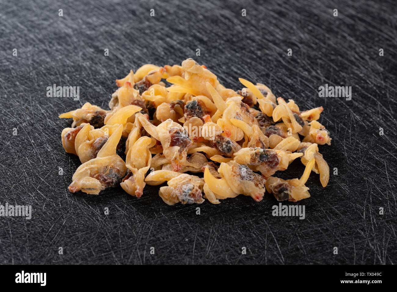 top view dry conch meat on dark background Stock Photo - Alamy