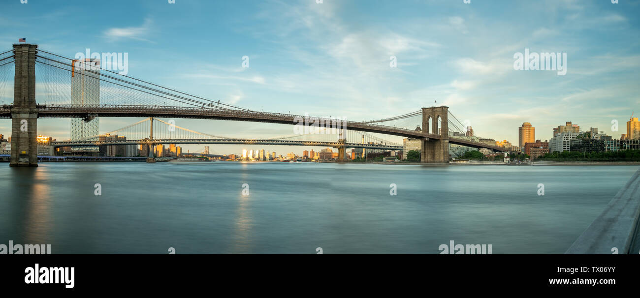Panoramic View of Three Main NYC Bridges At Dusk From Dock Stock Photo ...