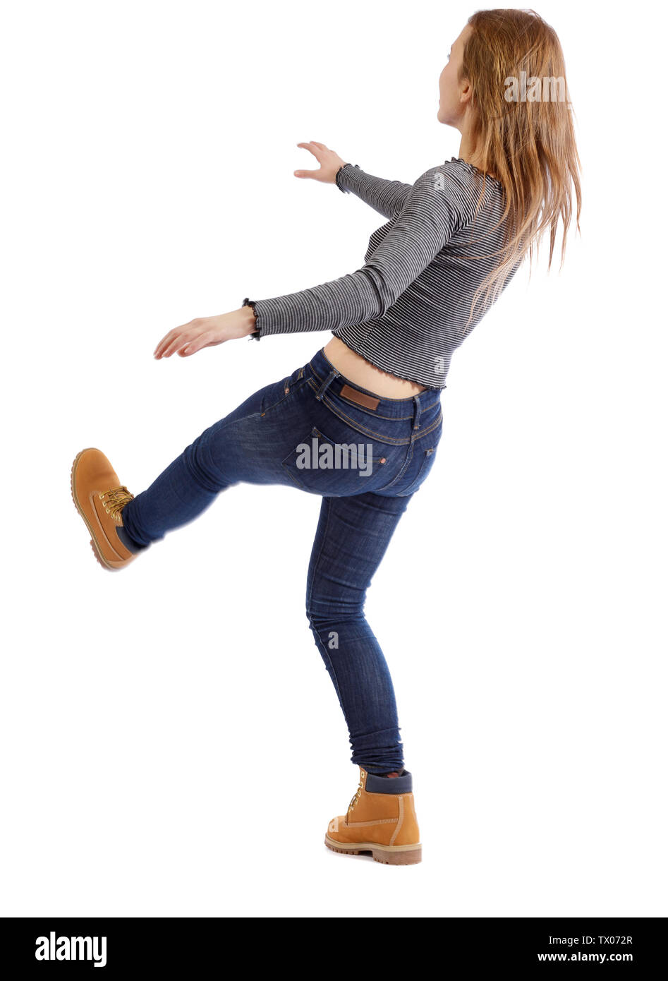 Balancing young woman. or dodge falling woman. Rear view people ...