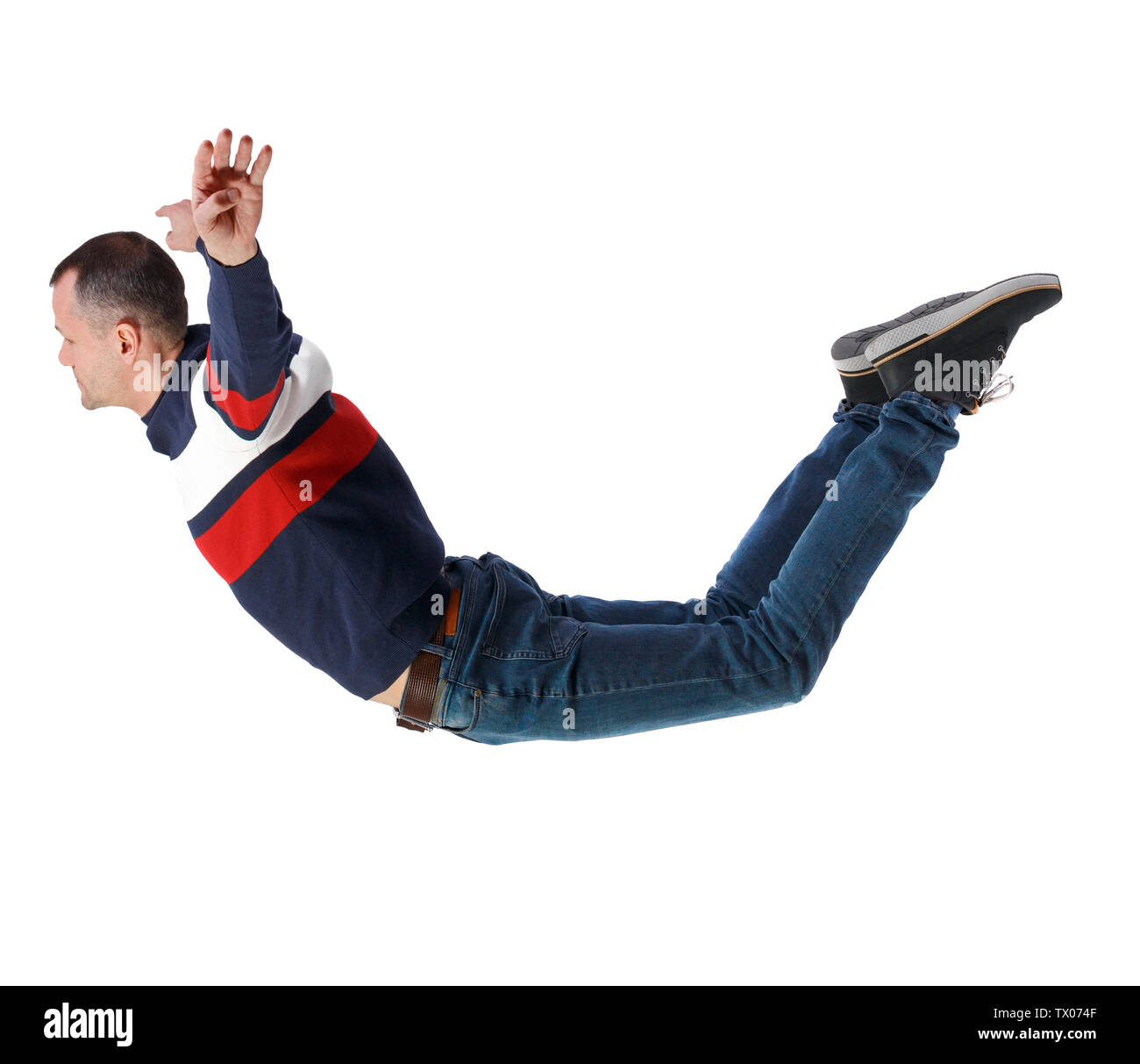 Side view of man in zero gravity or a fall. guy is flying, falling or ...