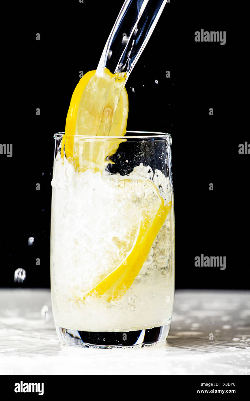 Splash clear lemonade Stock Photo - Alamy