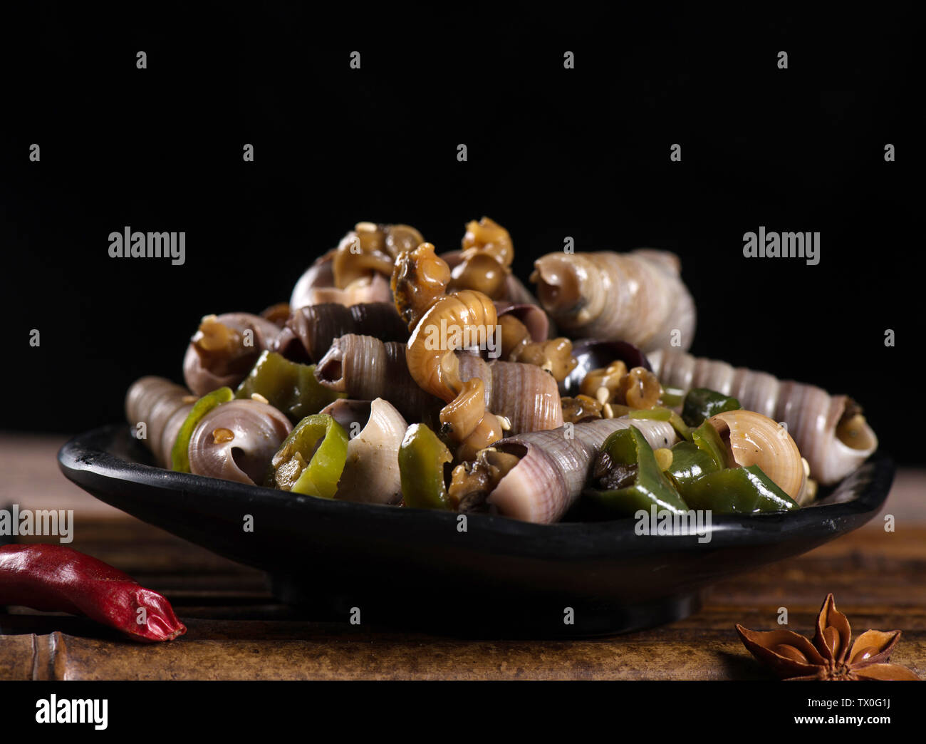Spicy seafood snail Stock Photo - Alamy