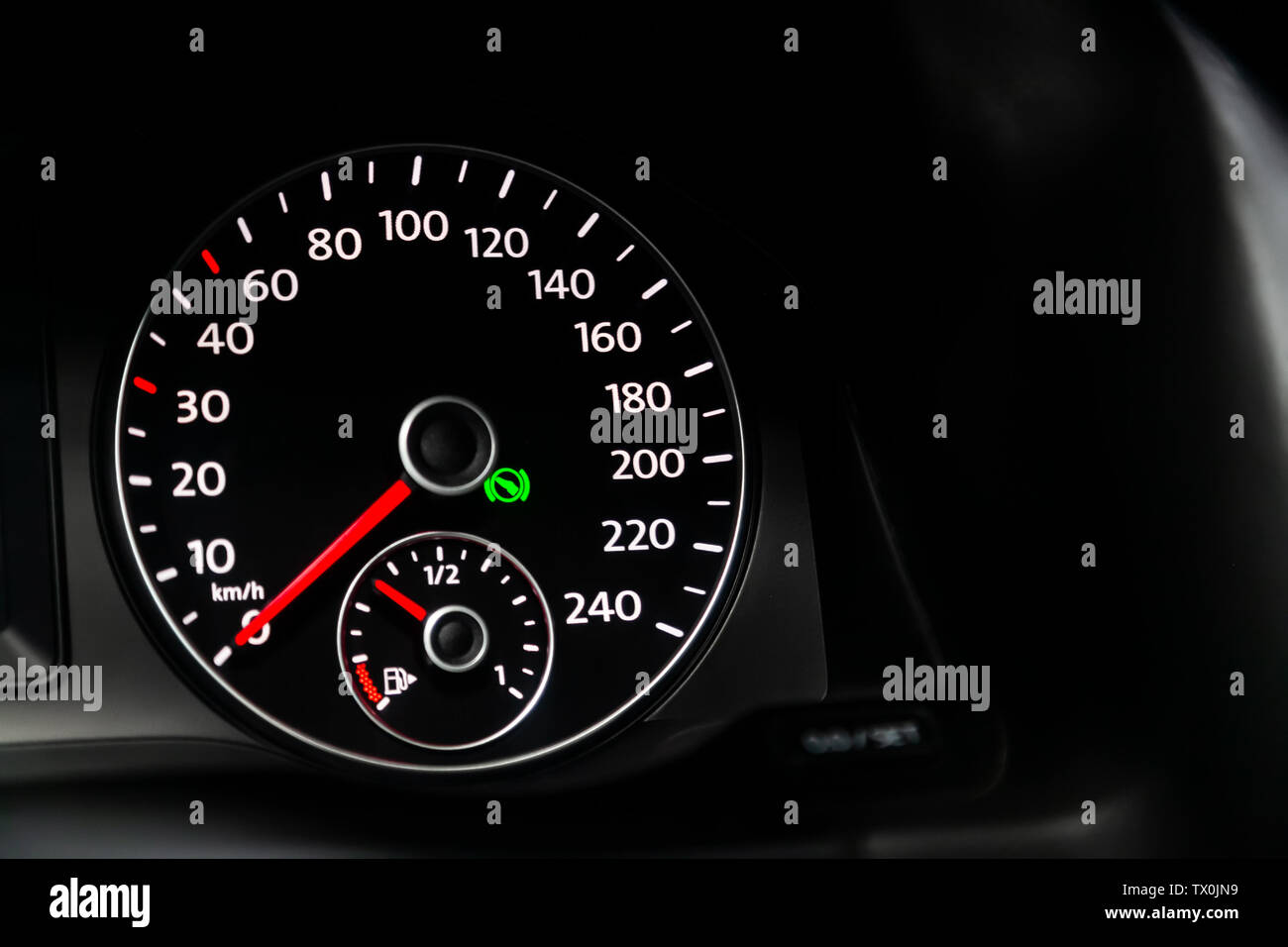 Car dashboard wuth white backlight: Odometer, speedometer, tachometer ...