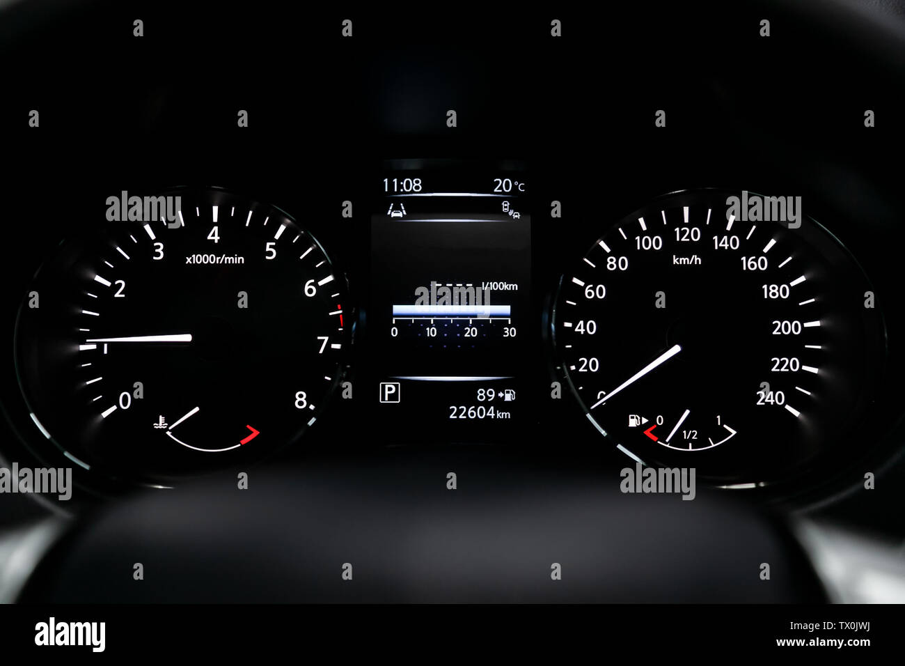 Car dashboard wuth white backlight: Odometer, speedometer, tachometer ...