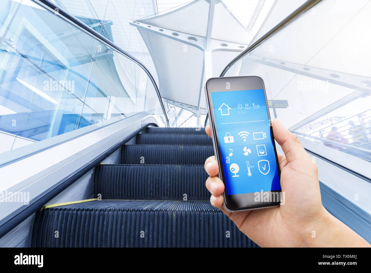 smart phone with smart home with modern escalator Stock Photo - Alamy