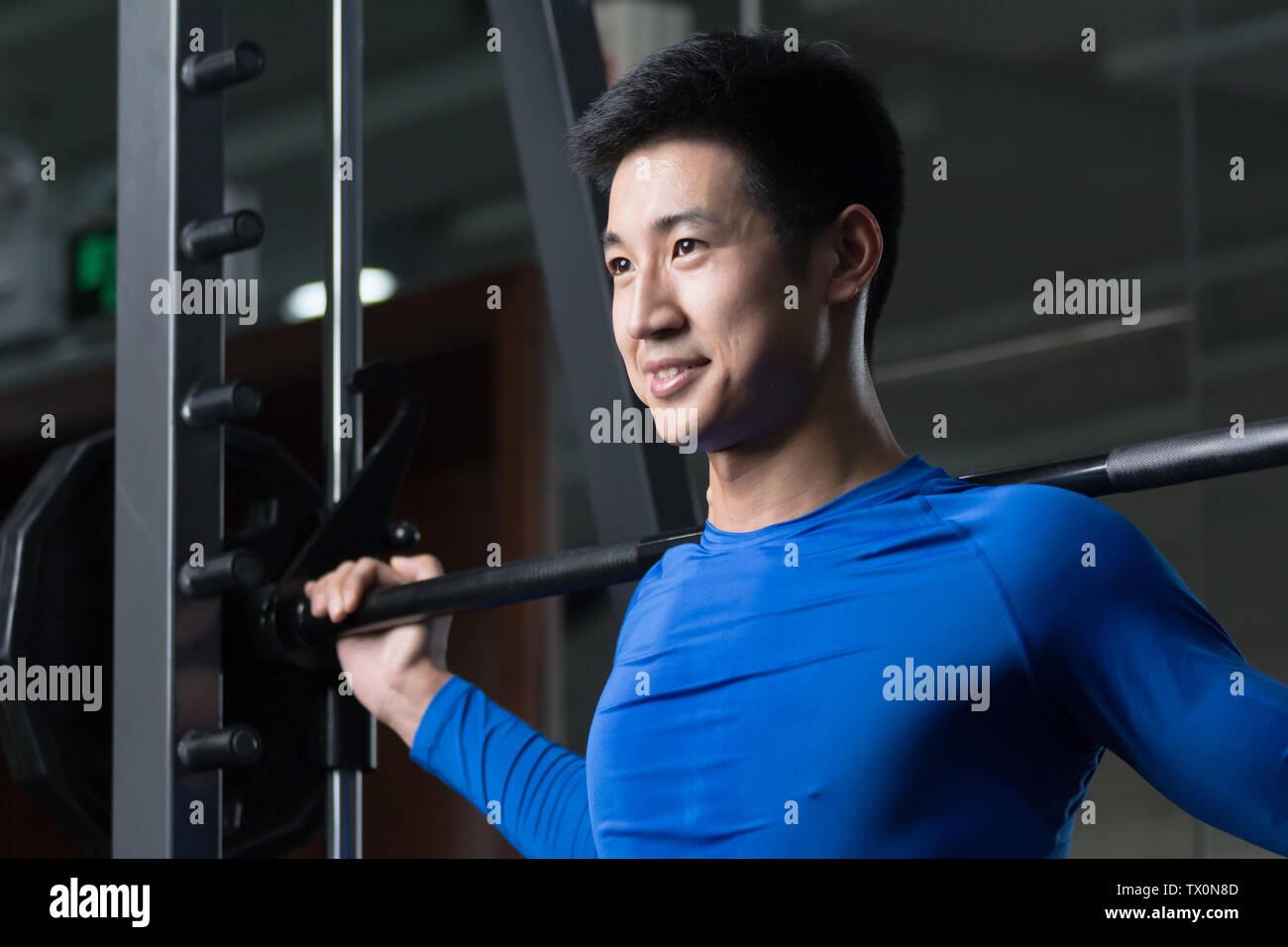 young asian man working out in modern gym Stock Photo - Alamy