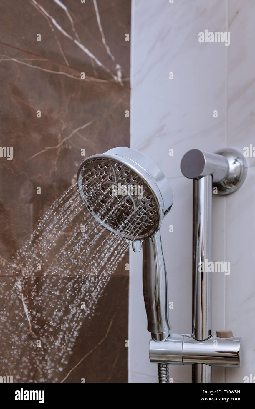 Water running from shower head and faucet in modern bathroom fresh ...