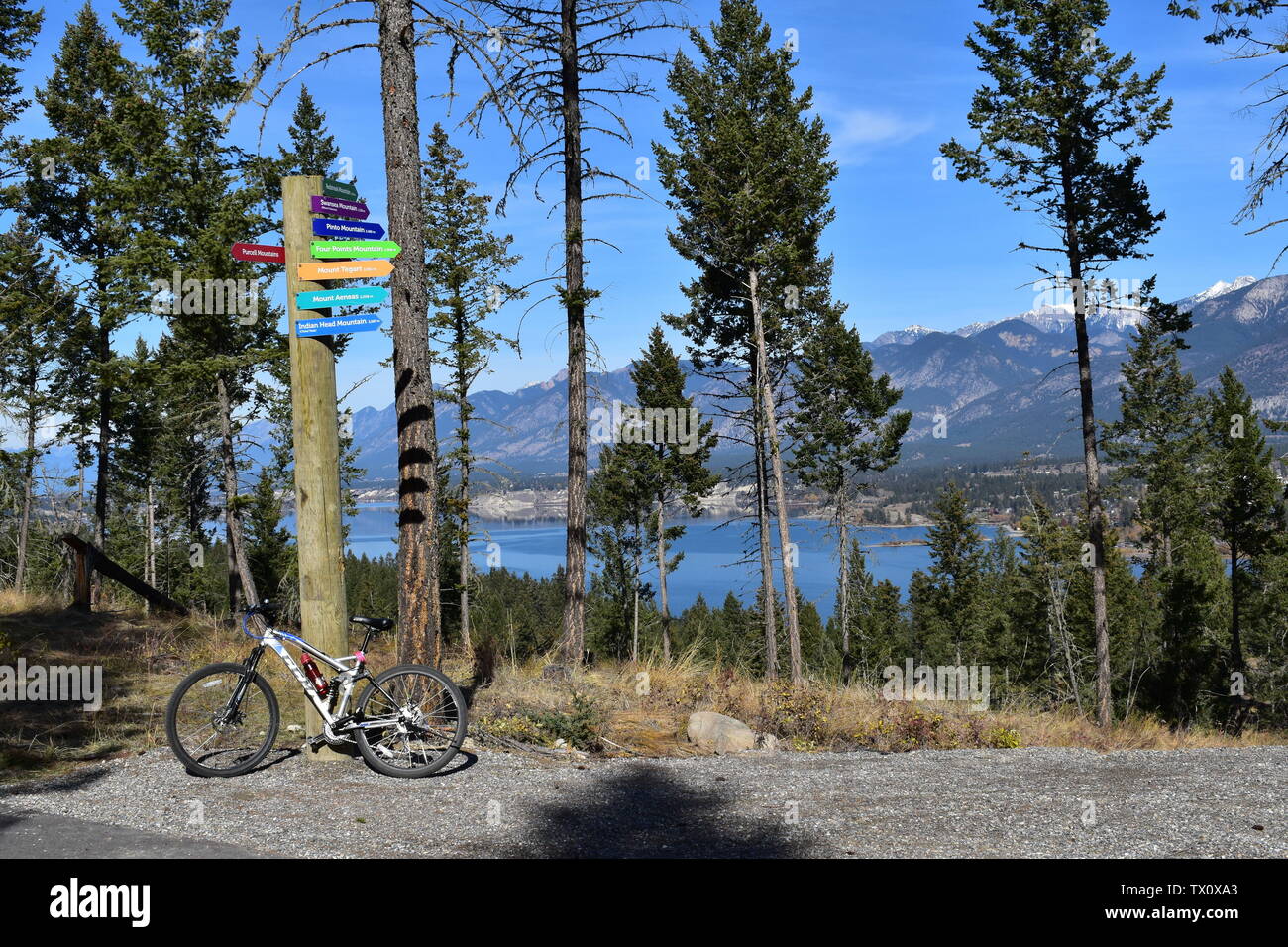 Lake and mountain view, with signpost indicating local mountains, from ...