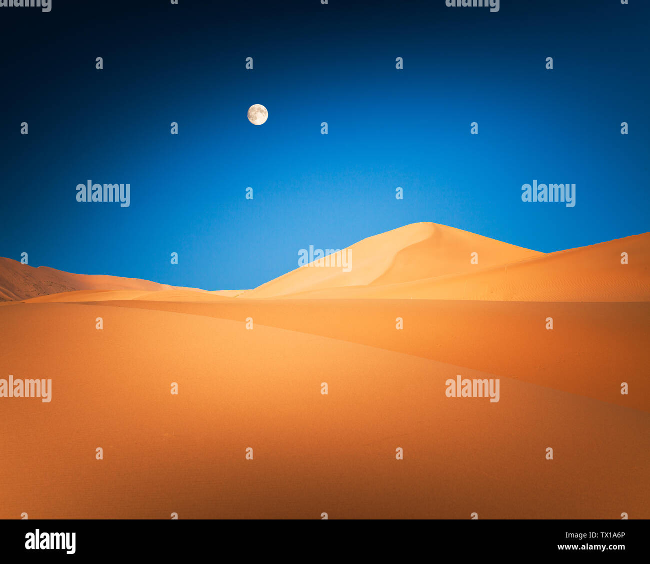 The moon comes out of Tianshan Stock Photo - Alamy