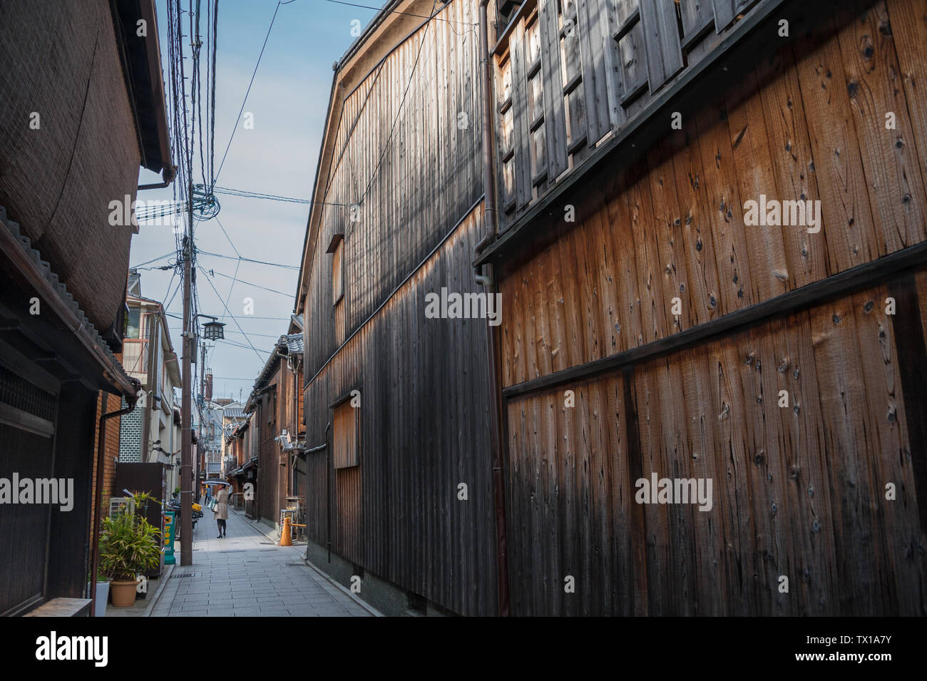 Traditional Edo-style architecture in the Gion District. Woman with ...