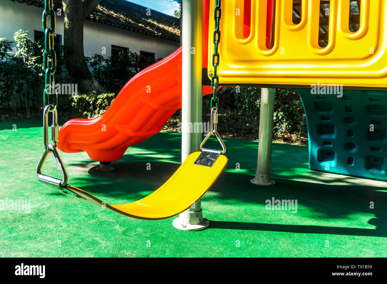 Slides and swings in the park Stock Photo - Alamy