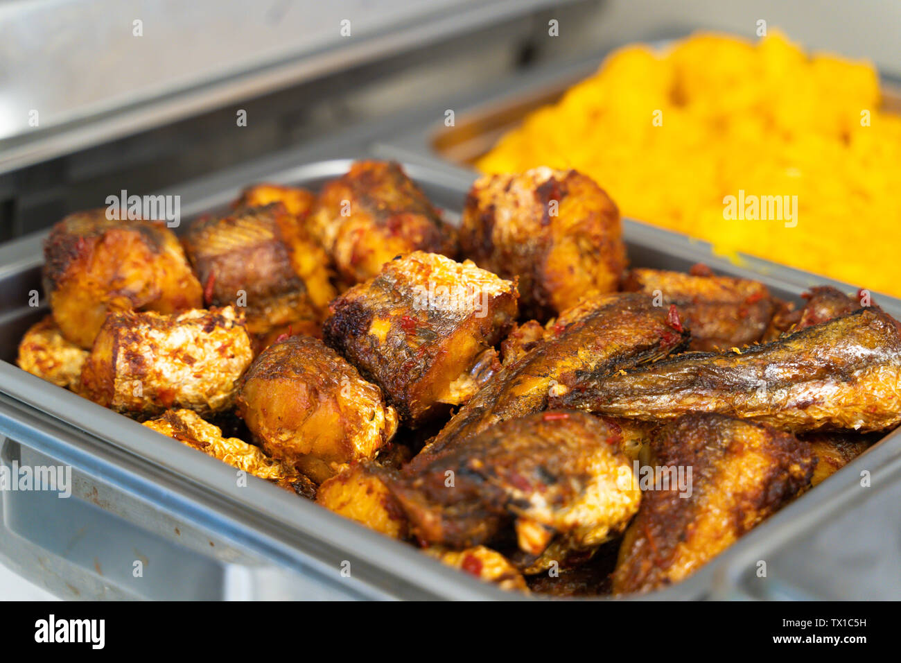 Fried Fish served on Nigerian Party buffet Stock Photo - Alamy