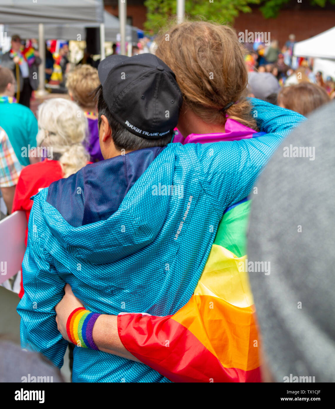 Gay men, embrace parade hi-res stock photography and images - Alamy