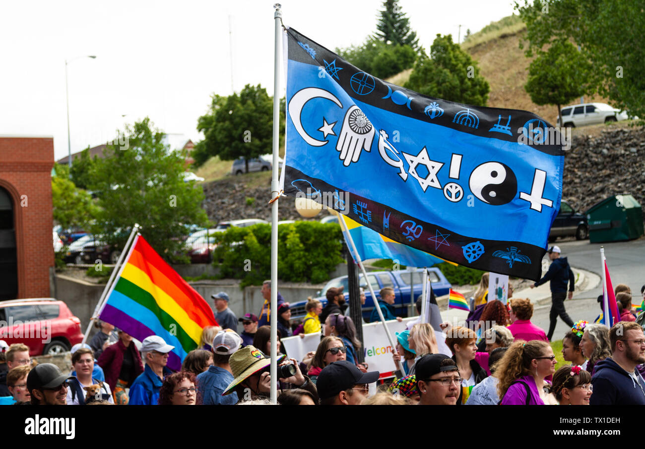 A coexist flag and rainbow flag on display by the participants of the ...