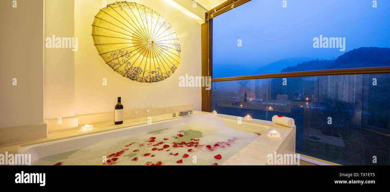 interior of bathroom with bathtub with rose Stock Photo - Alamy