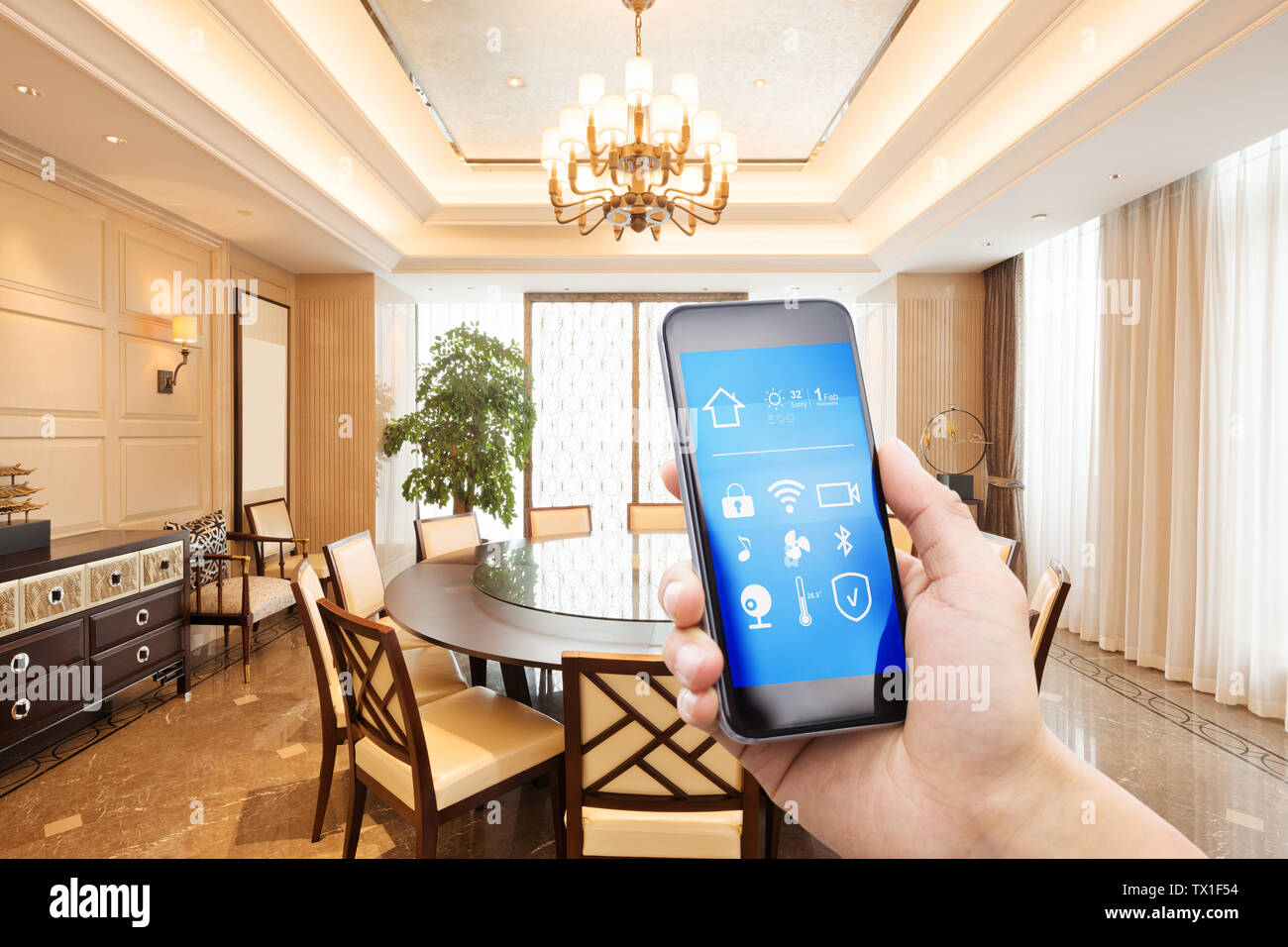 Mobile phone in smart home Stock Photo - Alamy