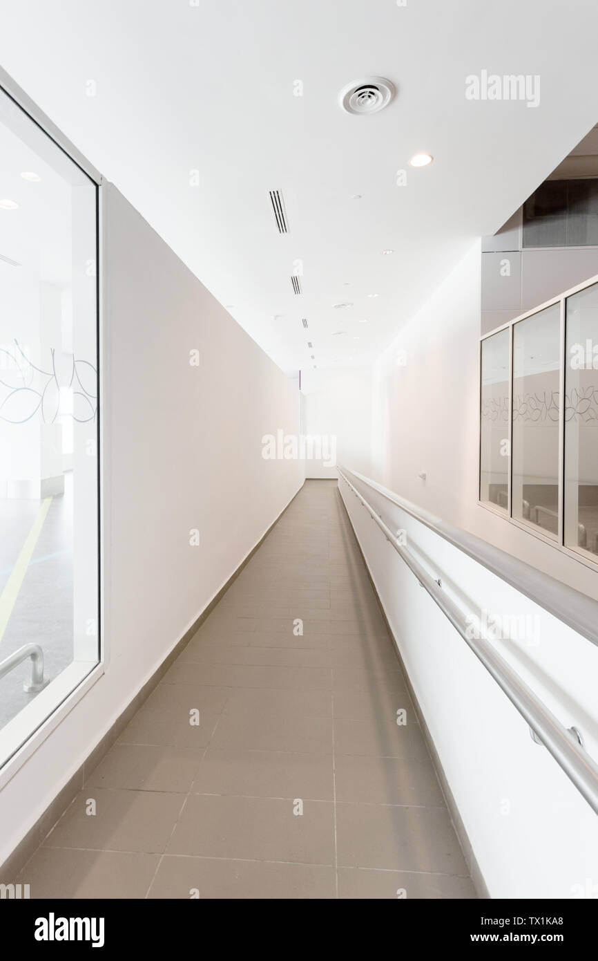 Modern office corridor with wheelchair pathway Stock Photo - Alamy
