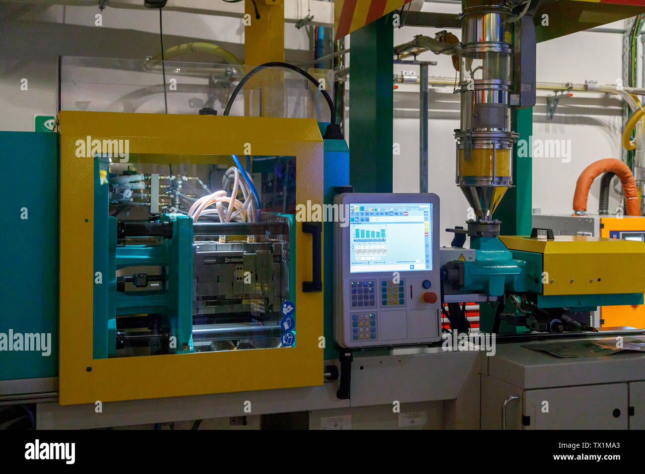 DUBAI, UAE, JANUARY 09, 2019: Plastic injection molding machine in the ...