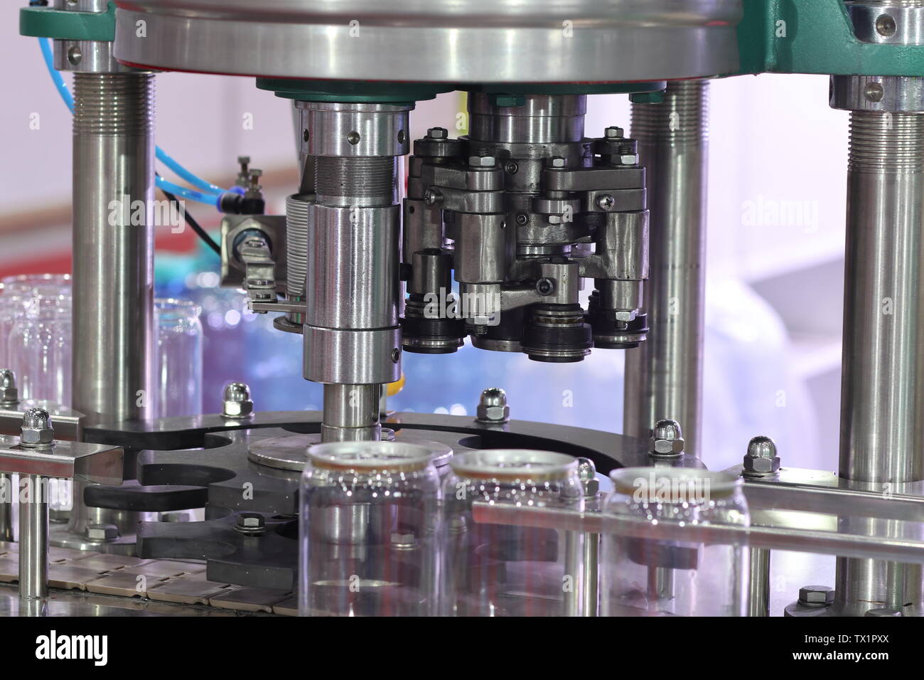 Aluminum lid packing machine for plastic can ; factory Stock Photo - Alamy