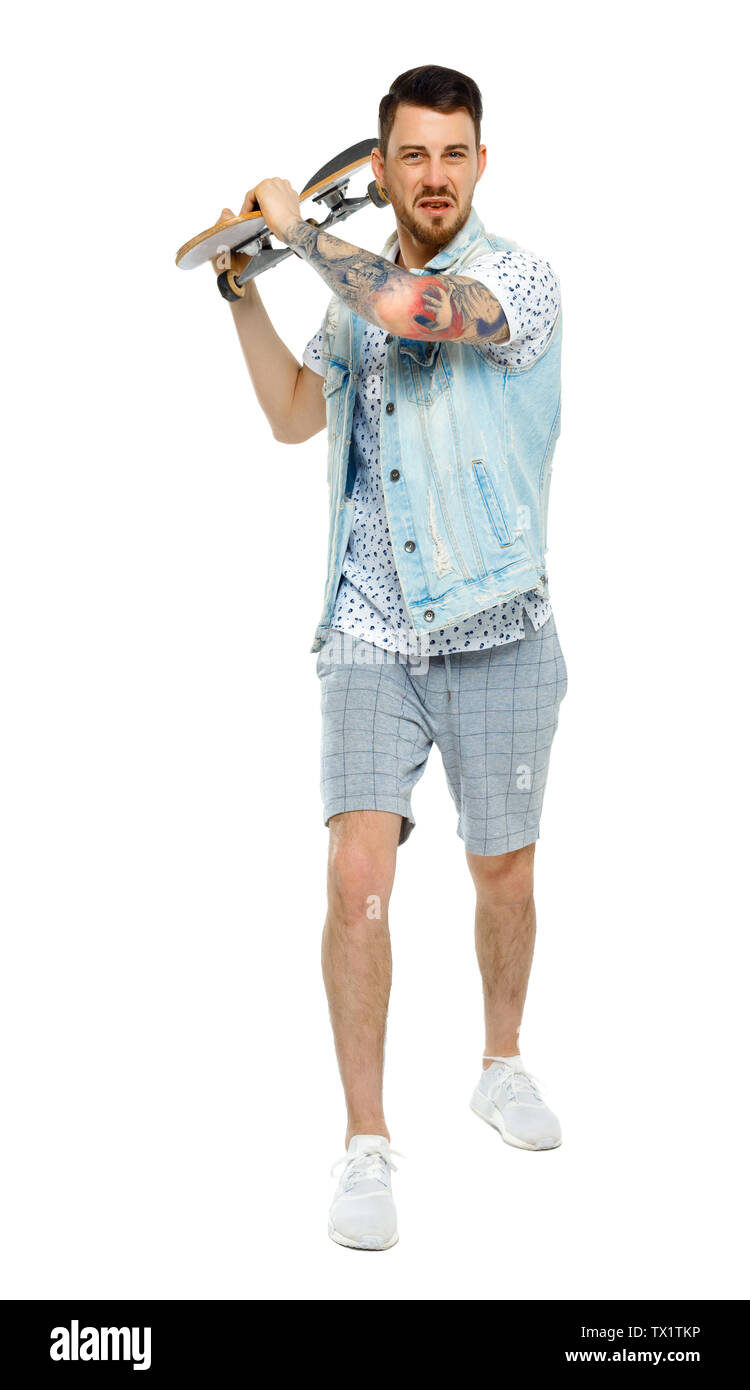 An angry tattooed man attacks. The guy swung to hit the skateboard ...