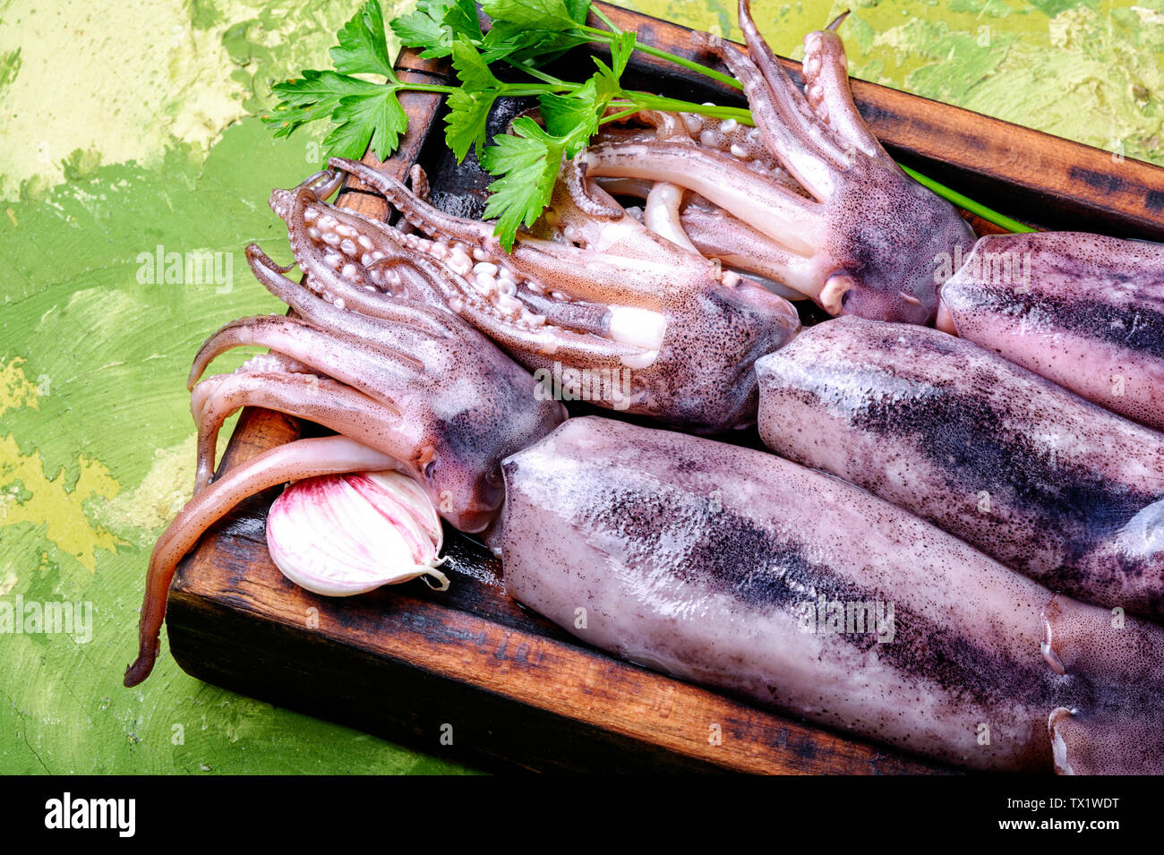 Fresh squid on the kitchen board.Fresh raw cuttlefish Stock Photo - Alamy