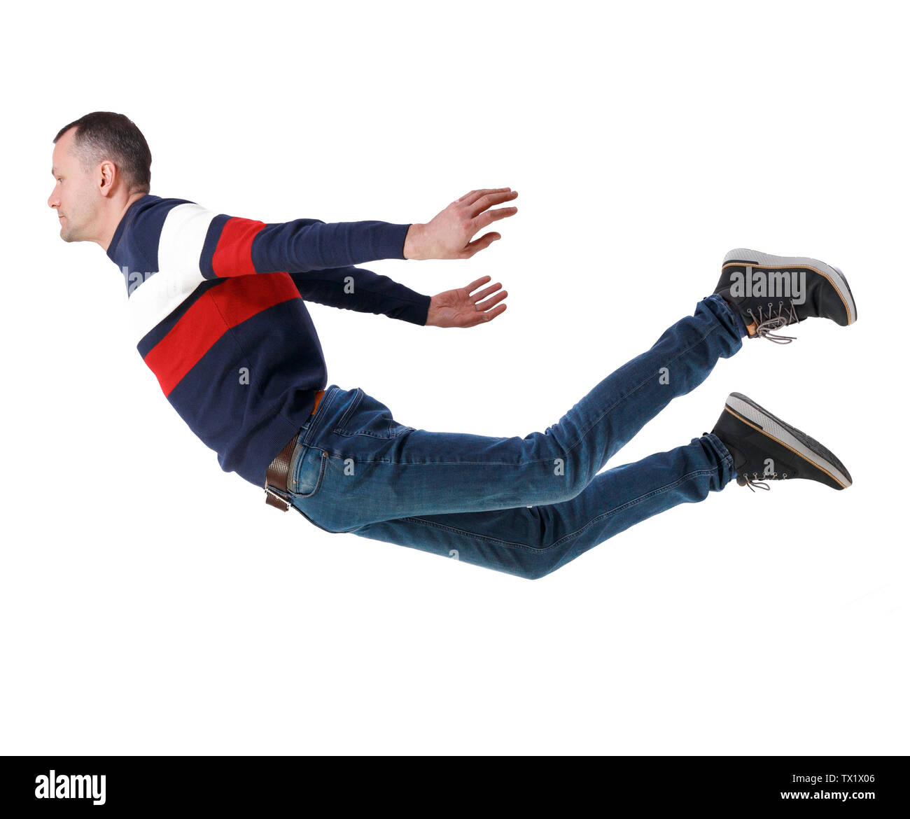 Side view of man in zero gravity or a fall. guy is flying, falling or ...