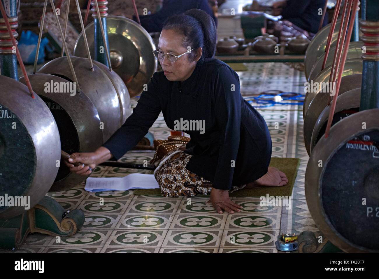 Gamelan musician are playing their instrument in Yogyakarta Palace ...