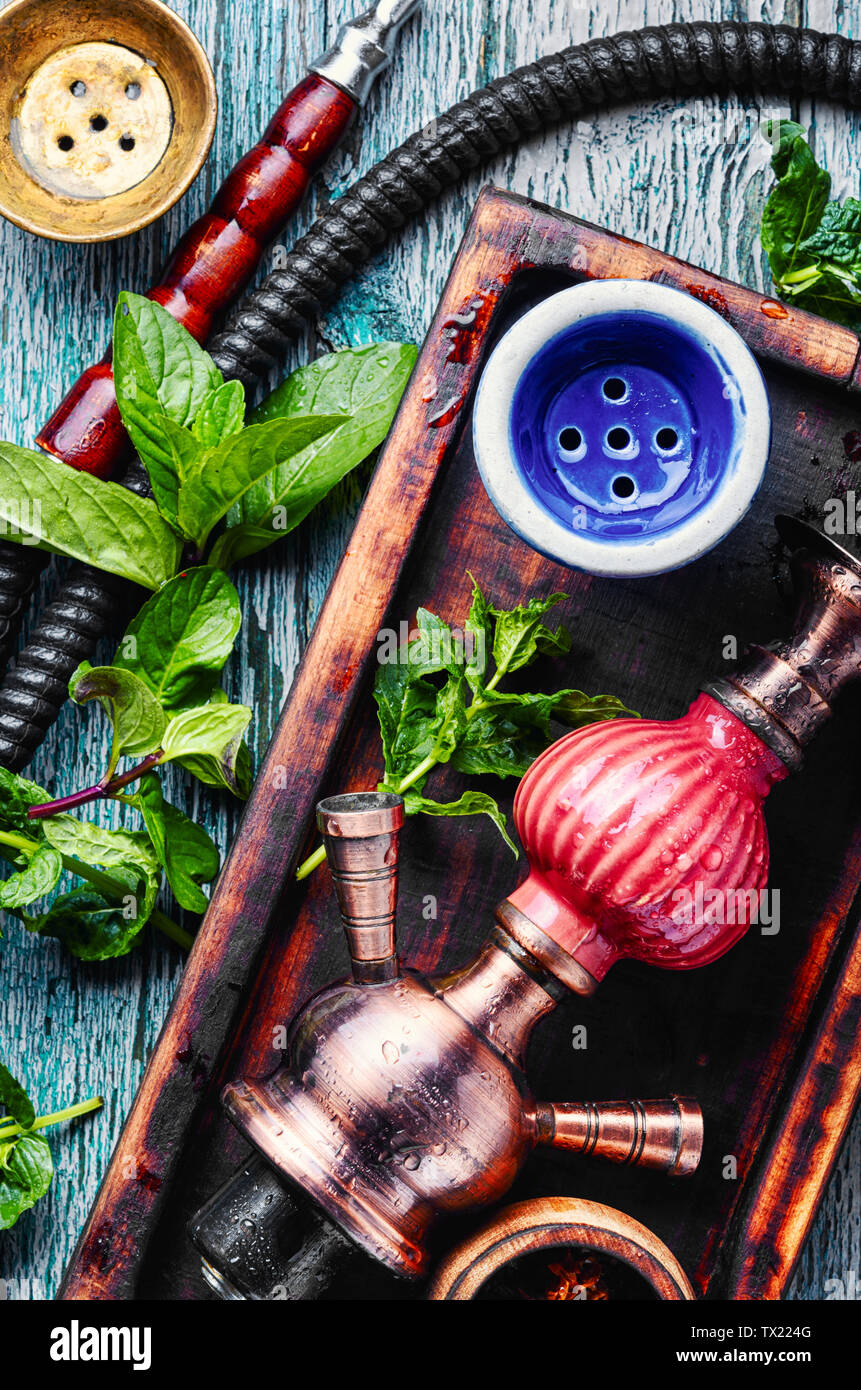 Smoking hookah with mint flavor.Shisha mint tobacco.Shisha hookah with ...