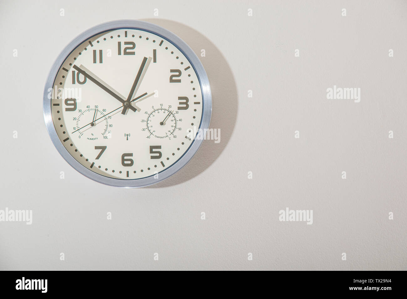 Clock on wall Stock Photo - Alamy