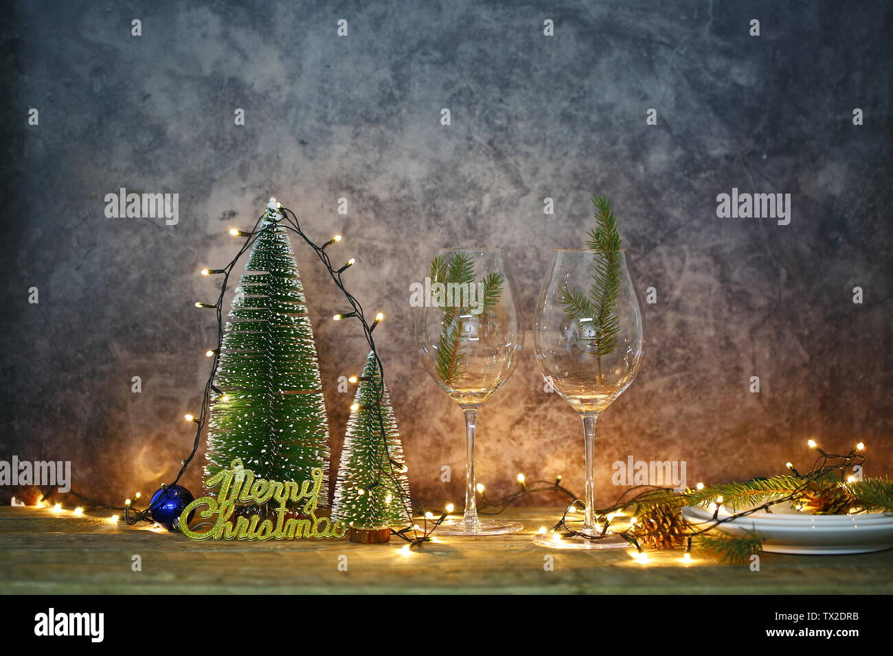 Christmas day scene, Christmas tree and red wine glass Stock Photo - Alamy