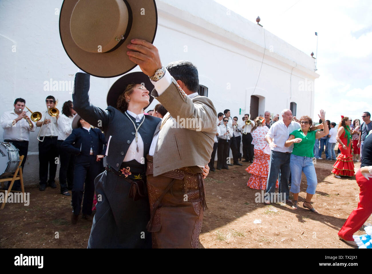 A couple dancing Sevilla dance during a fiesta in Andalusia in Spain ...